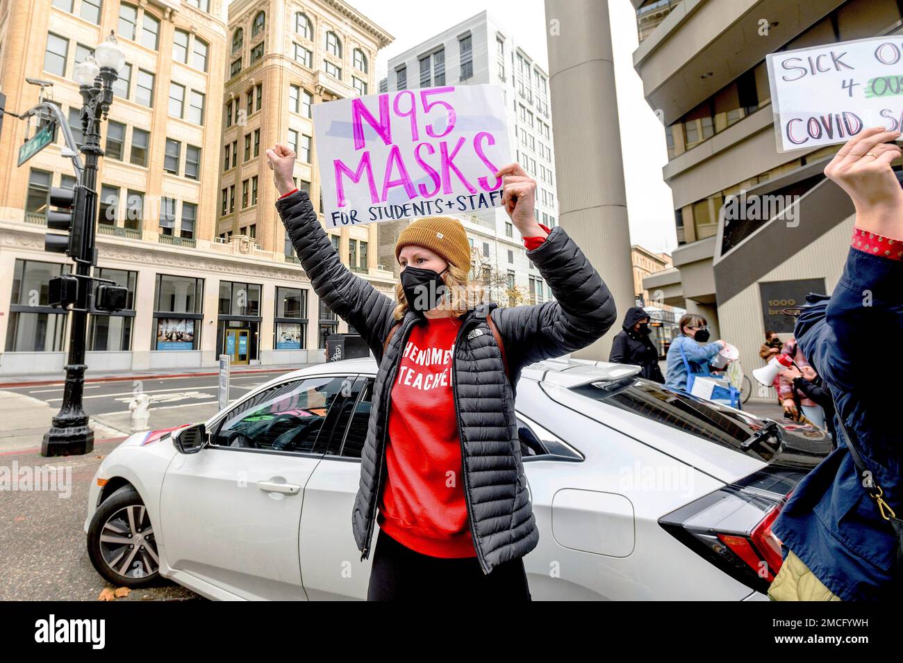 Elementary school teacher Alex Brandenburg protests for stronger COVID ...