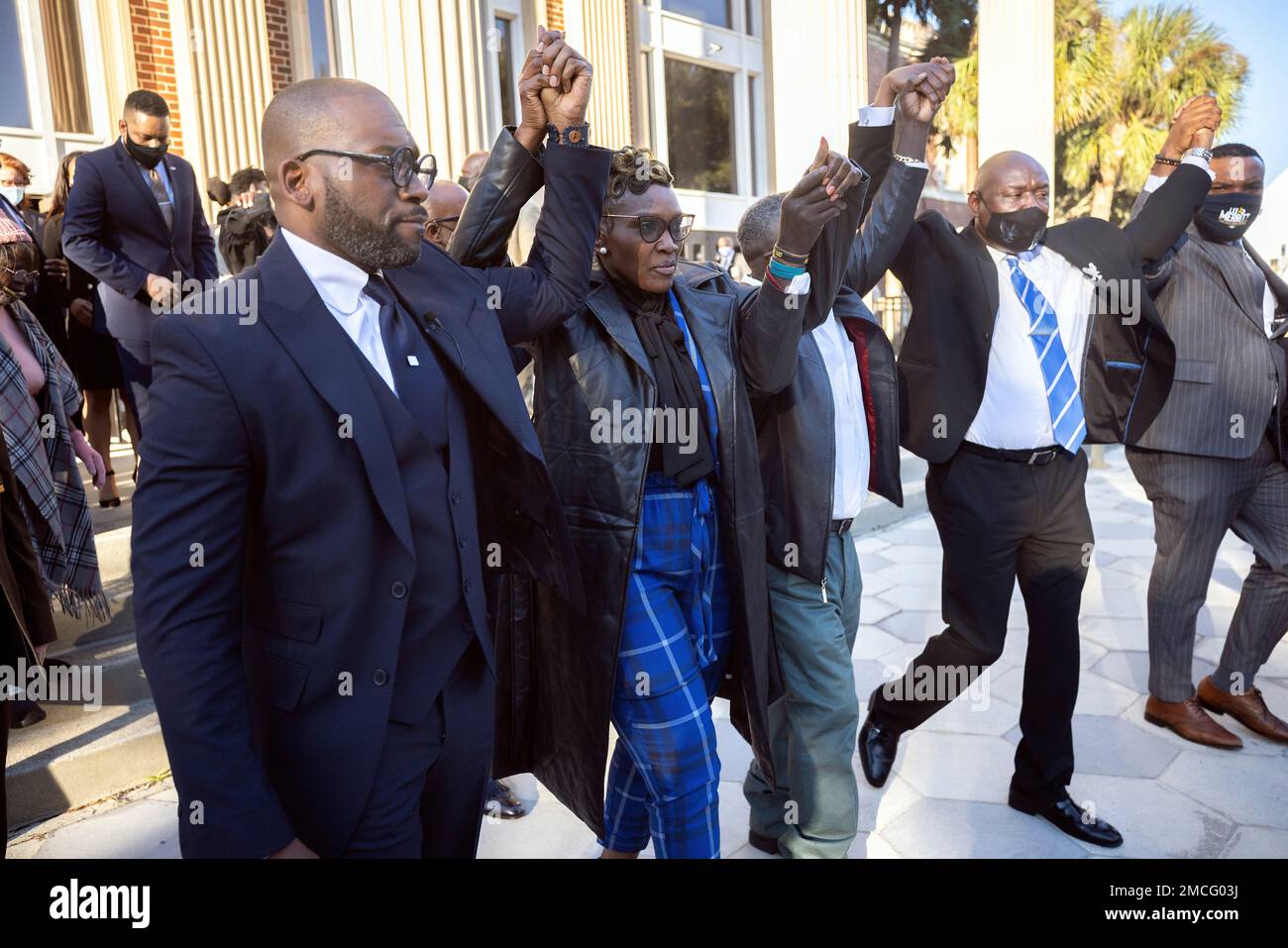Ahmaud Arbery's mother Wanda Cooper-Jones, center, walks out of the ...