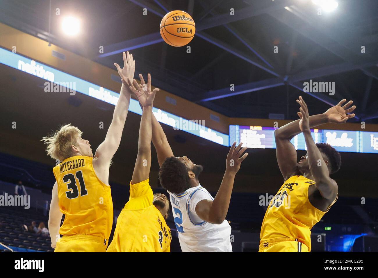 UCLA forward Cody Riley (2) fights for a rebound against Long Beach ...