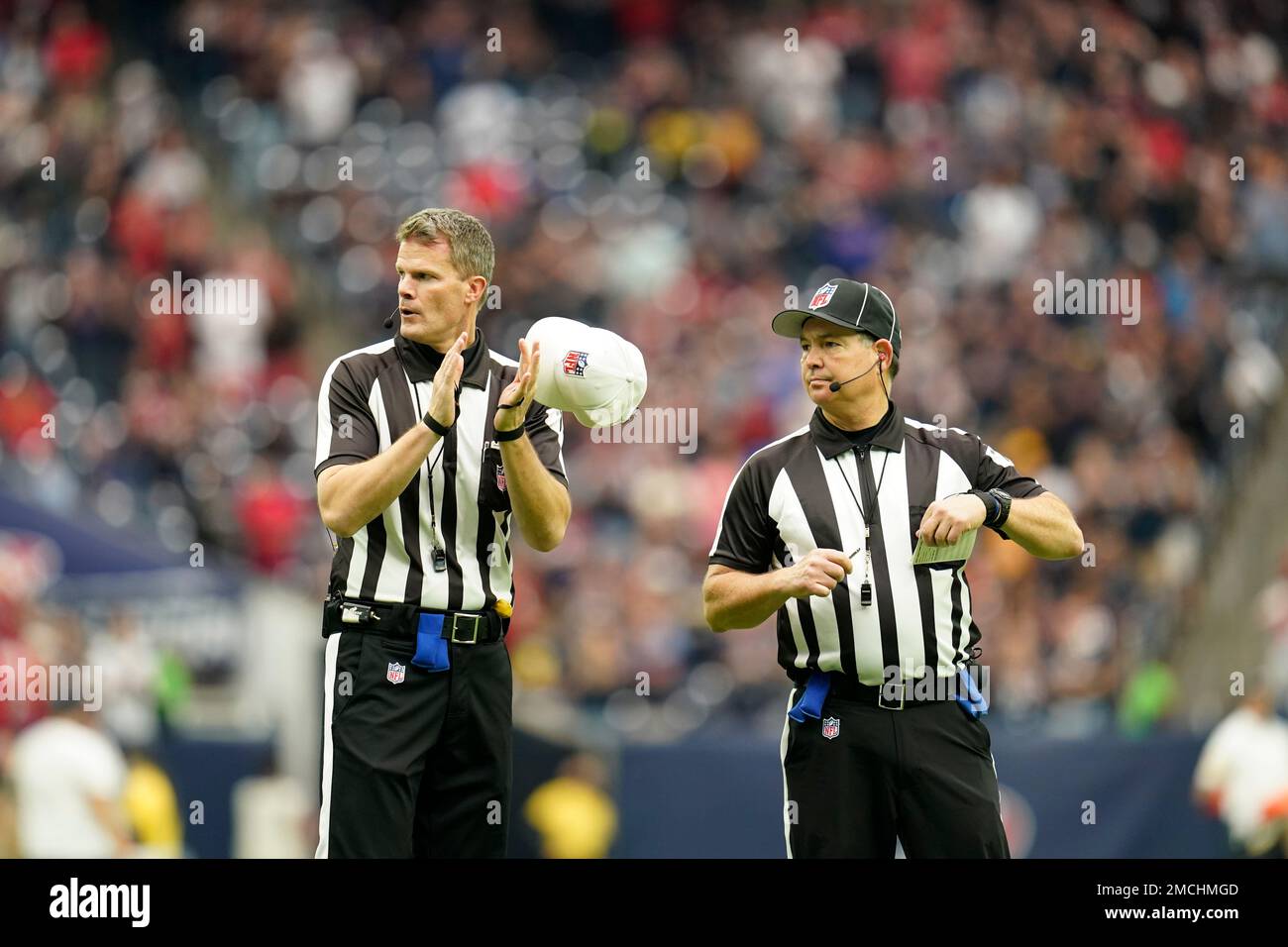NFL official, referee Clay Martin (19) and back judge Gregory Wilson ...