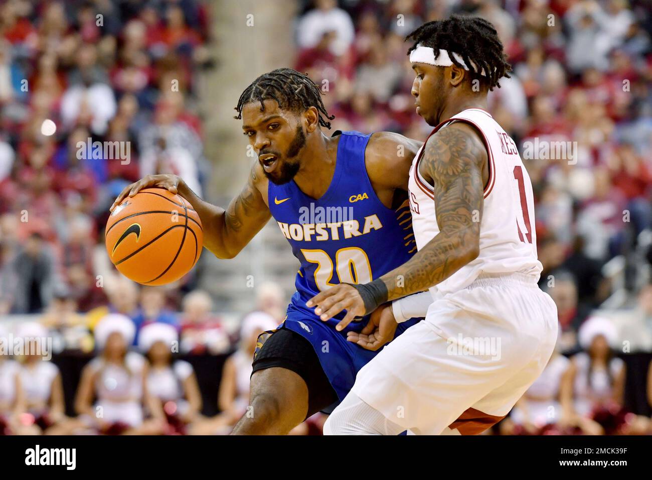 Hofstra guard Jalen Ray (20) tries to get past Arkansas guard Chris ...