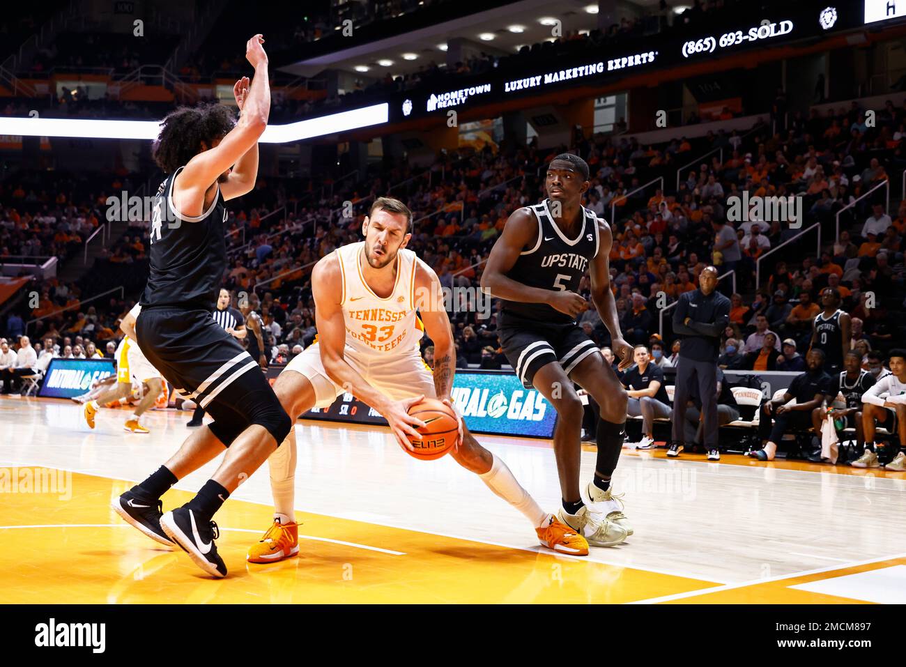 Tennessee forward Uros Plavsic (33) works for a shot between USC ...