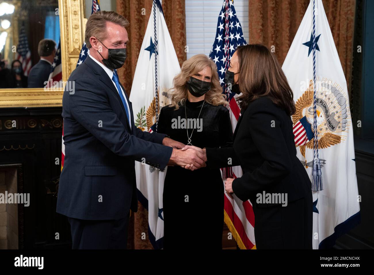 Vice President Kamala Harris, right, shakes hands with former Sen. Jeff ...