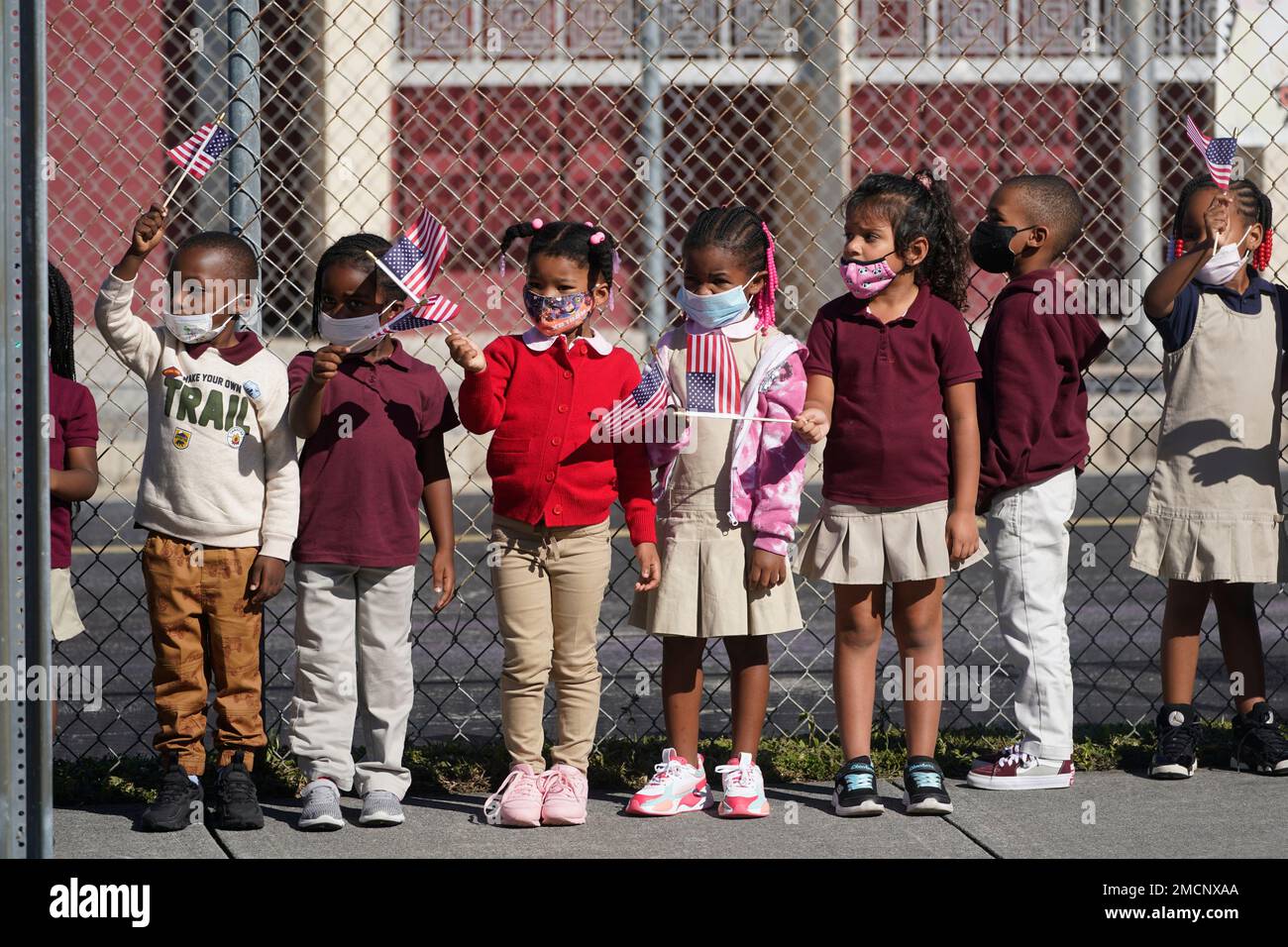 Students at Carrie P. Meek/Westview K-8 Center in Miami, wave at a ...