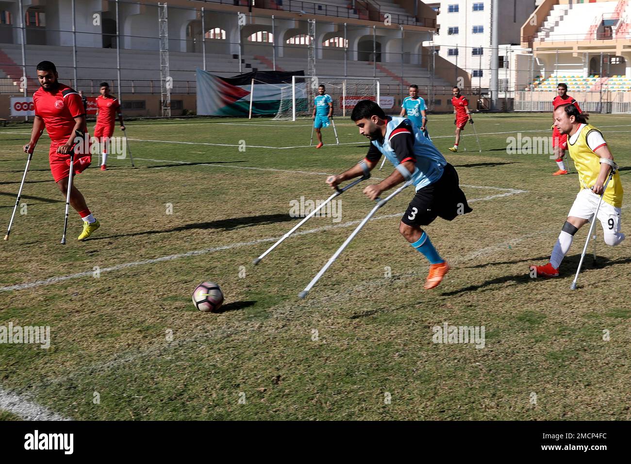 Palestinian amputees play a soccer match while using their crutches ...