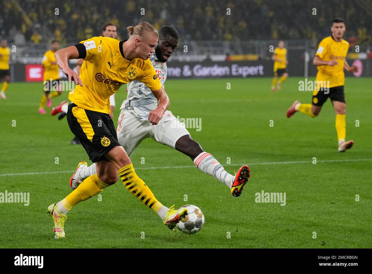 File- Dortmund's Erling Haaland, left, challenges for the ball with ...