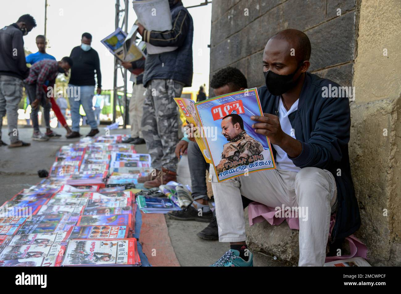 FILE - Ethiopians read newspapers and magazines reporting on the ...
