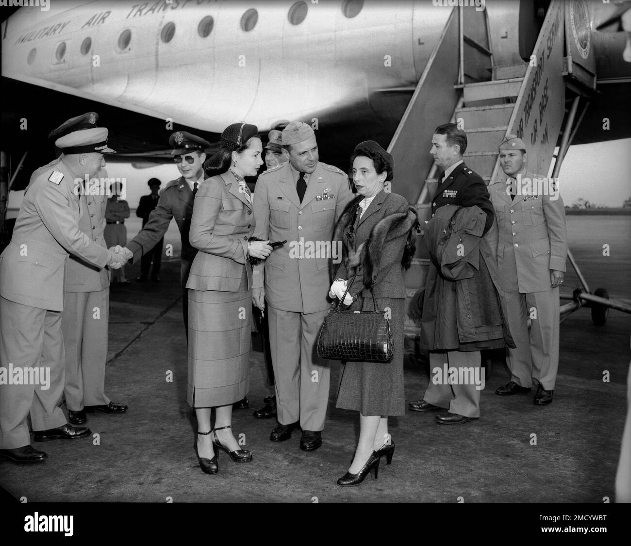 Assistant Secretary of Defense Anna M. Rosenberg, right, is greeted by ...