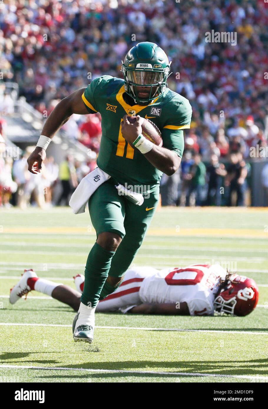 Baylor quarterback Gerry Bohanon (11) scores on a 14-yard touchdown as ...