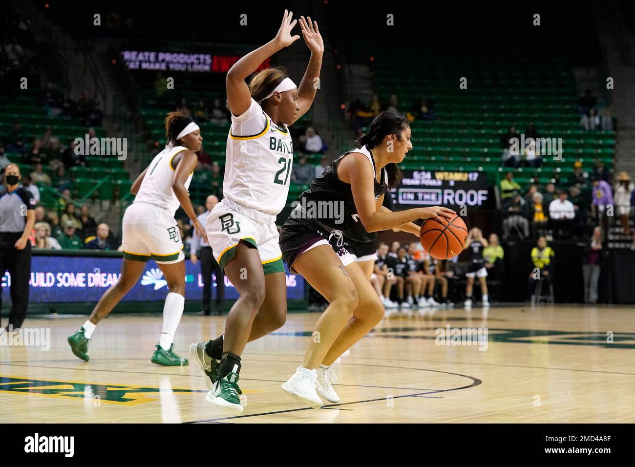 Baylor guard Ja'Mee Asberry (21) defends as West Texas A&M guard Azia ...