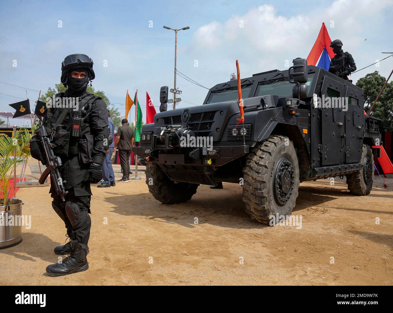 A National Security Guard (NSG) commando stands guard in front of ...