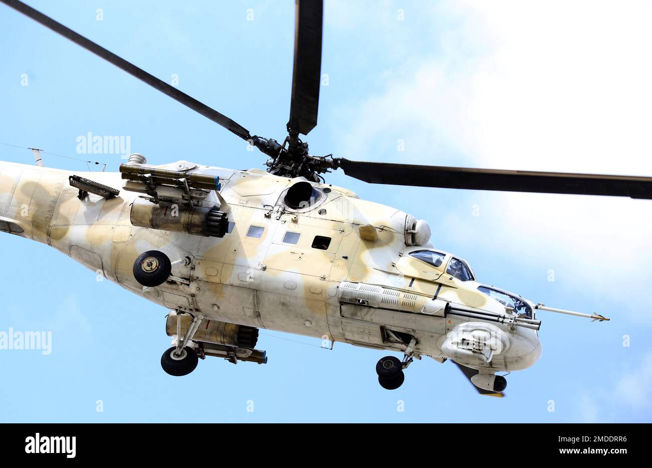 A military helicopter from the Cypriot air force, flies over a military ...