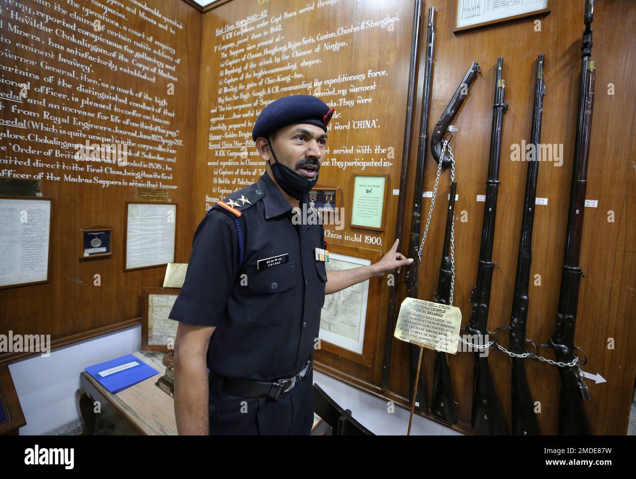 An Indian army officer shows media weapons used by soldiers of Madras ...