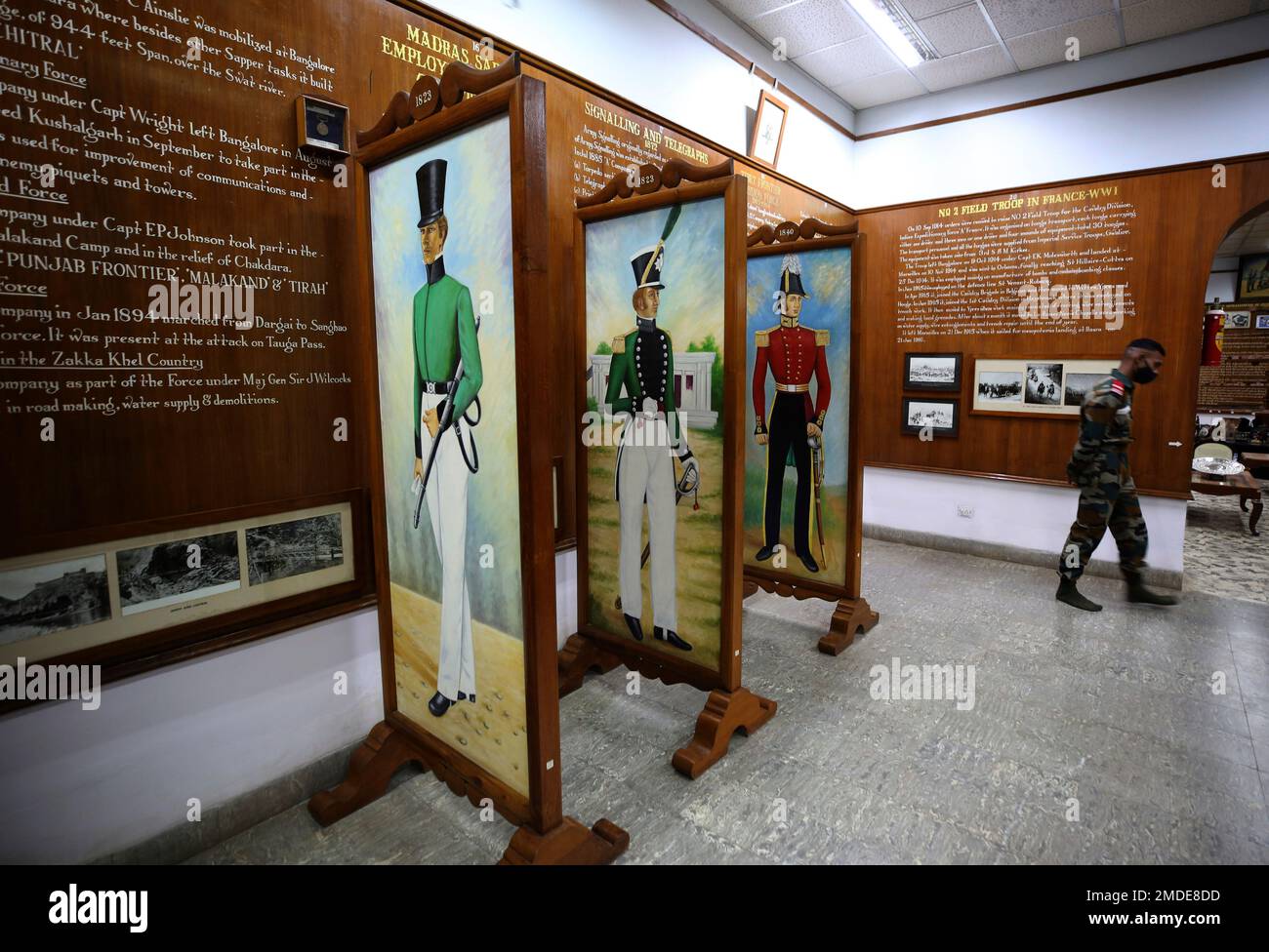 An Indian army soldier walks past the murals of British officers who ...