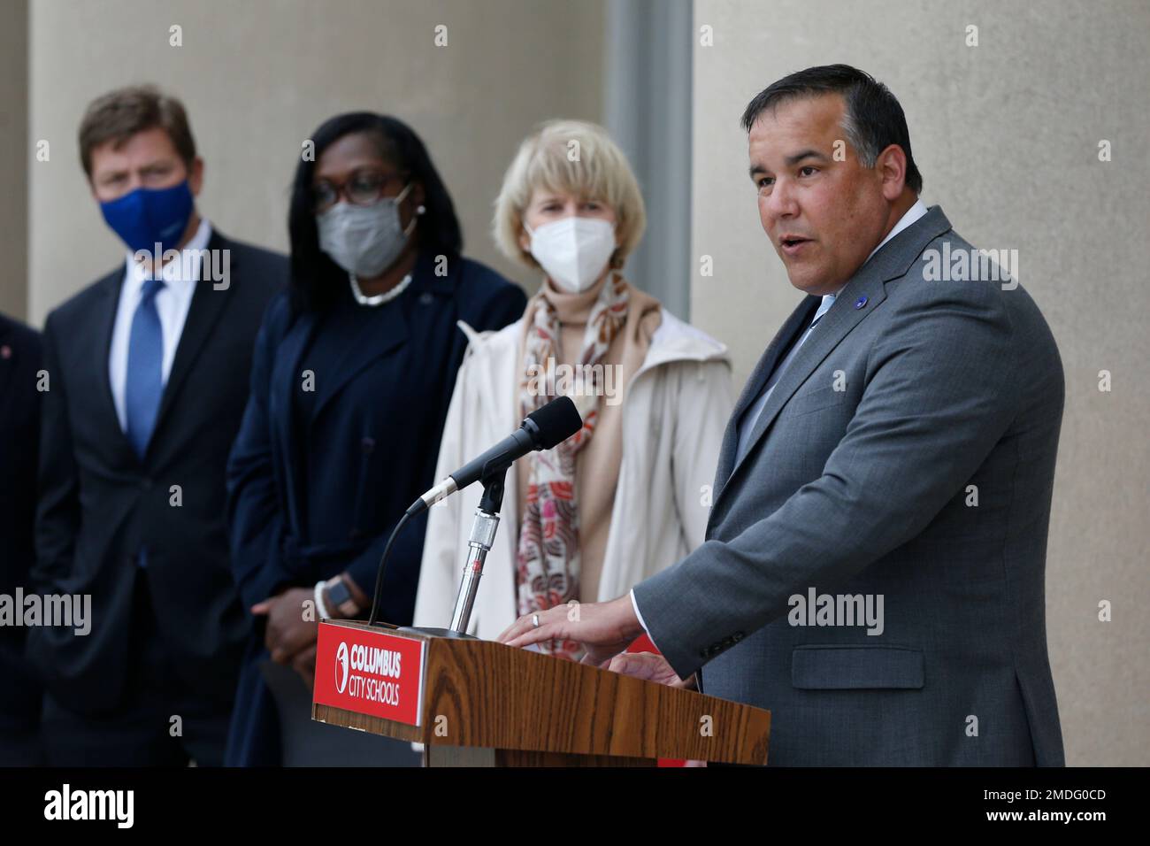 Columbus Mayor Andrew Ginther, right, speaks during a news conference ...