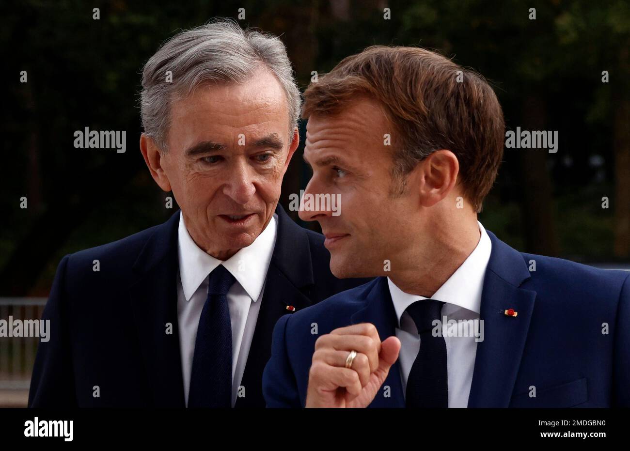 LVMH luxury group CEO Bernard Arnault, left, and French President ...