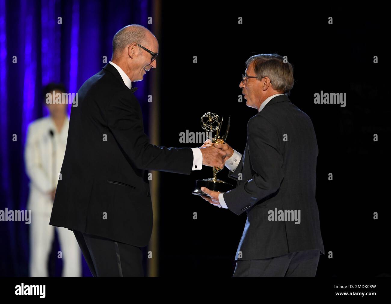 Russell Swanson, left, and Scott Buckler accept the Emmy for ...