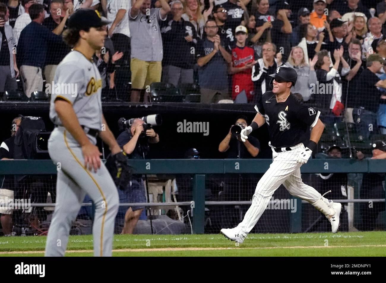 Chicago White Sox's Gavin Sheets, right, heads home after his three-run ...