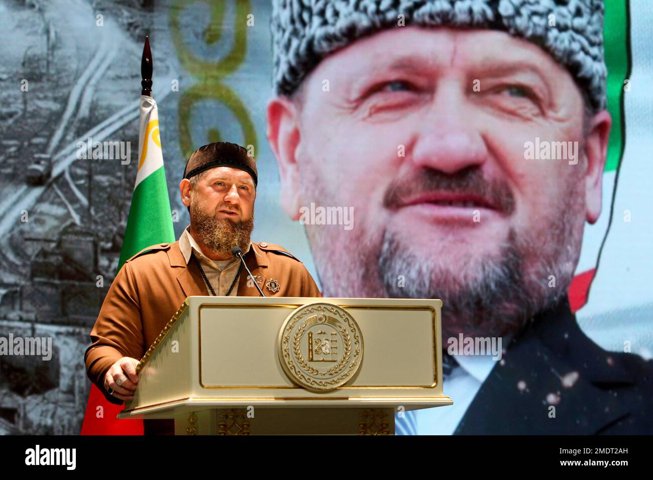 Chechnya's regional leader Ramzan Kadyrov speaks in front of a portrait ...