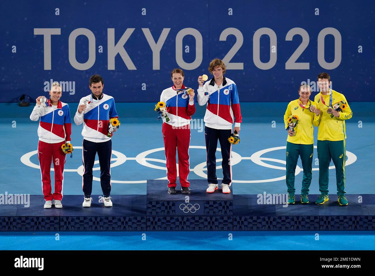 Gold medalist Anastasia Pavlyuchenkova and Andrey Rublev, middle, of ...