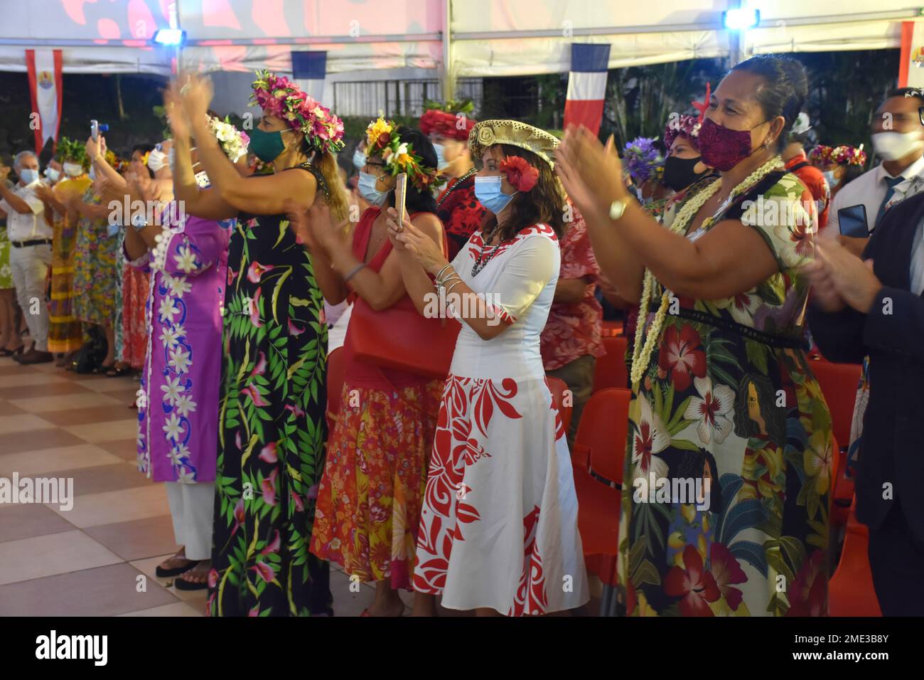 French Polynesians dressed in traditional clothes applause France's ...