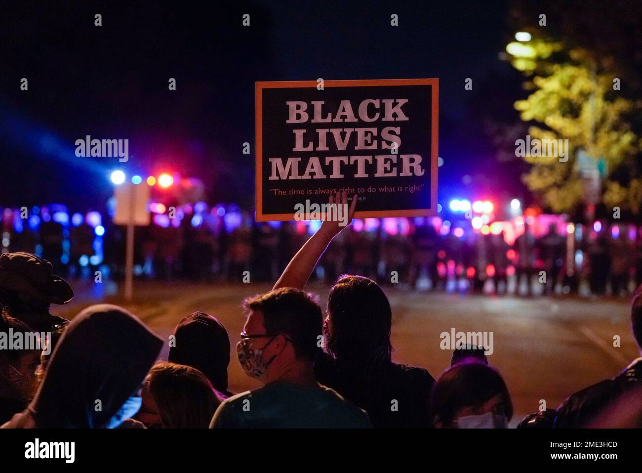 FILE - In this Oct. 2020, file photo, protesters and police line up in ...