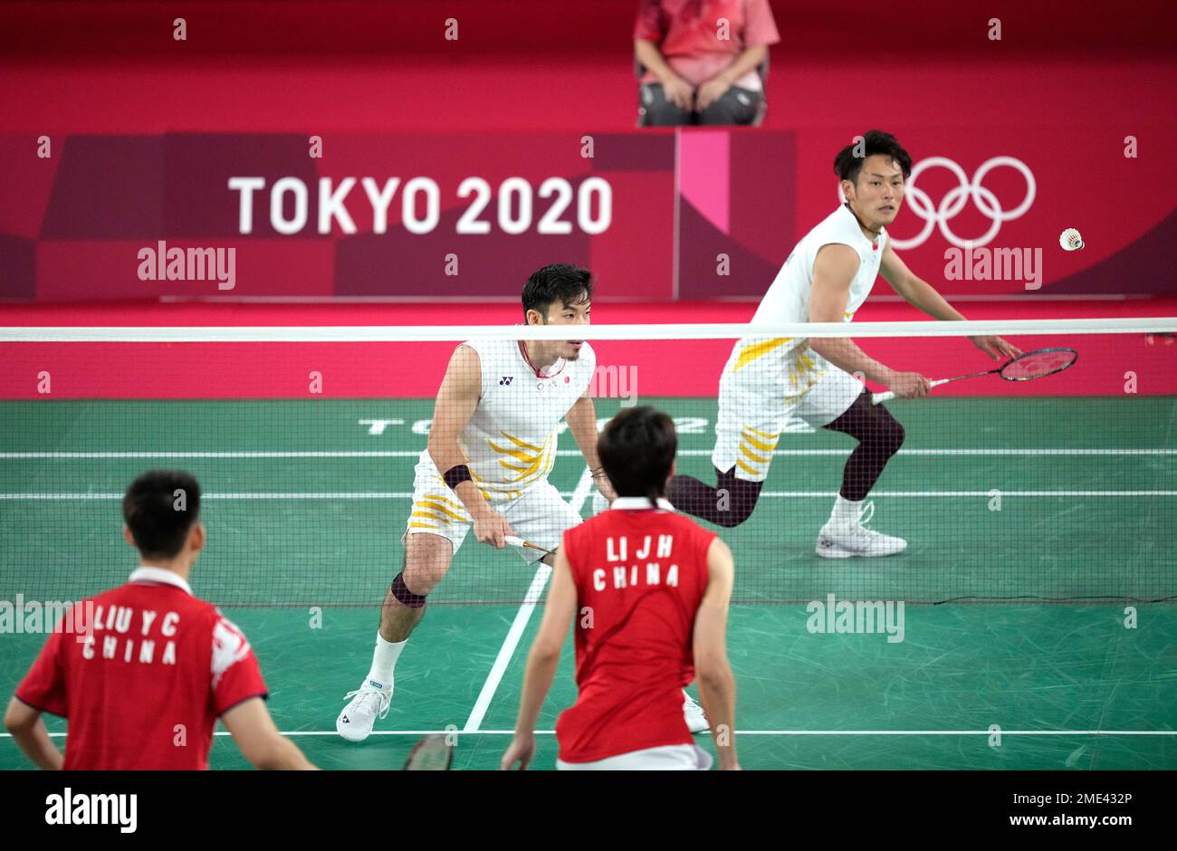 Japan's Takeshi Kamura and Keigo Sonoda play against China's Li Jun Hui ...