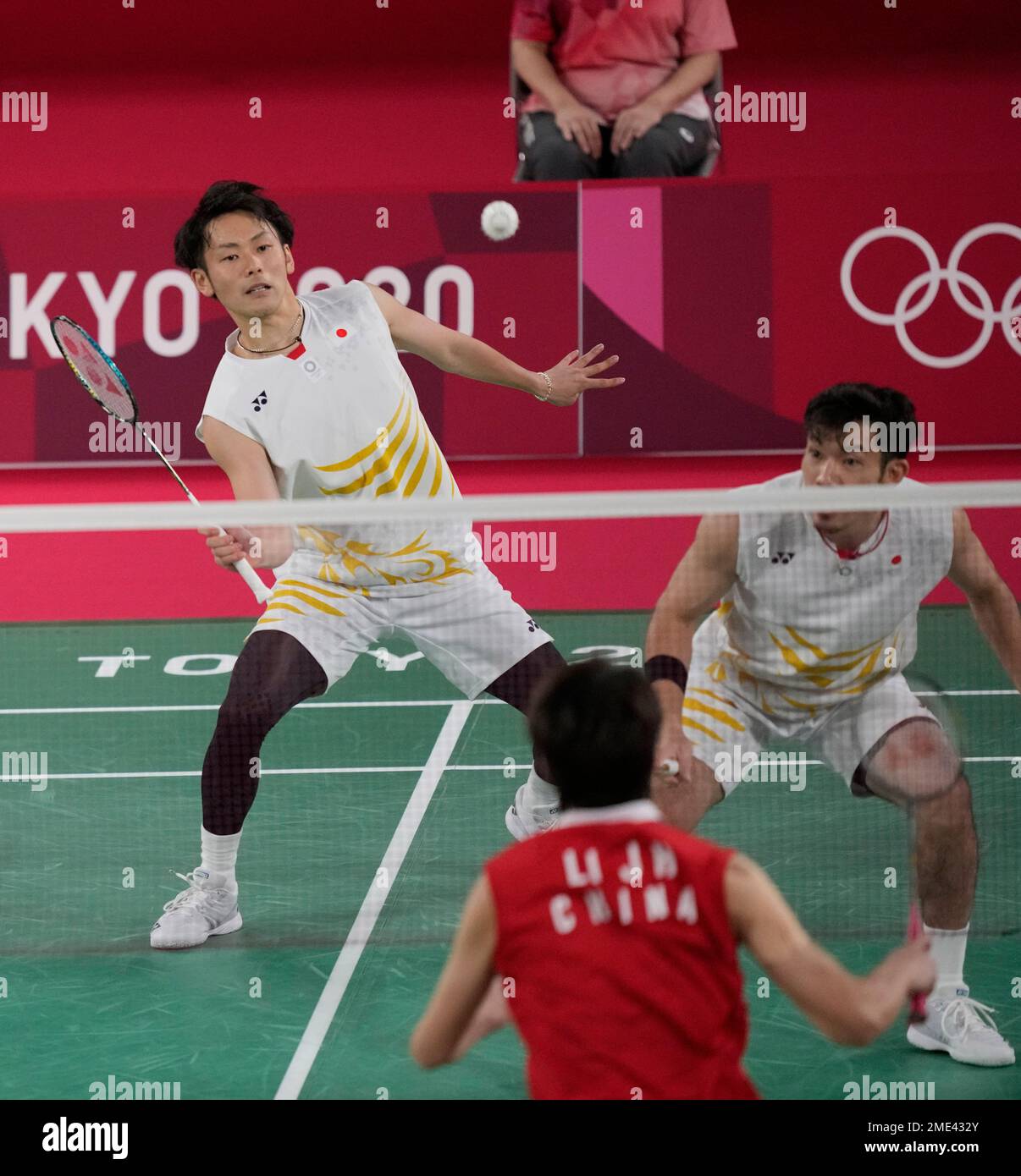 Japan's Takeshi Kamura and Keigo Sonoda play against China's Li Jun Hui ...