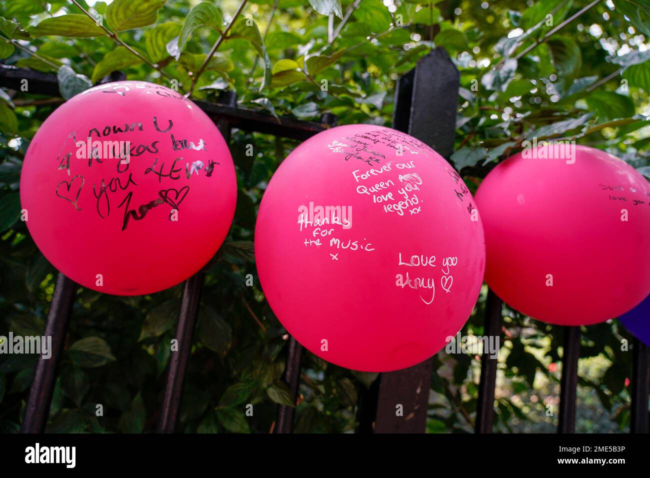 Tributes left outside the former home of Amy Winehouse in Camden ...