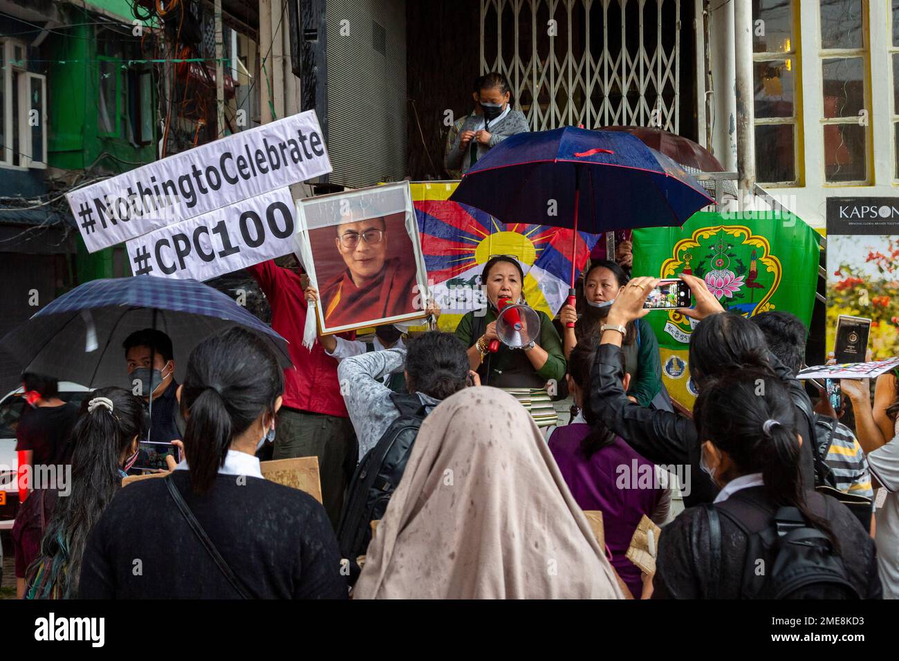 Exile Tibetans carry a portrait of Tibetan spiritual leader the Dalai ...