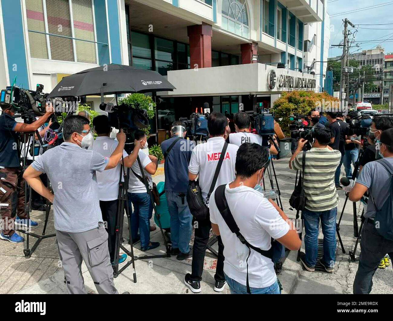 Media gather outside the Capitol Medical Center where former Philippine ...