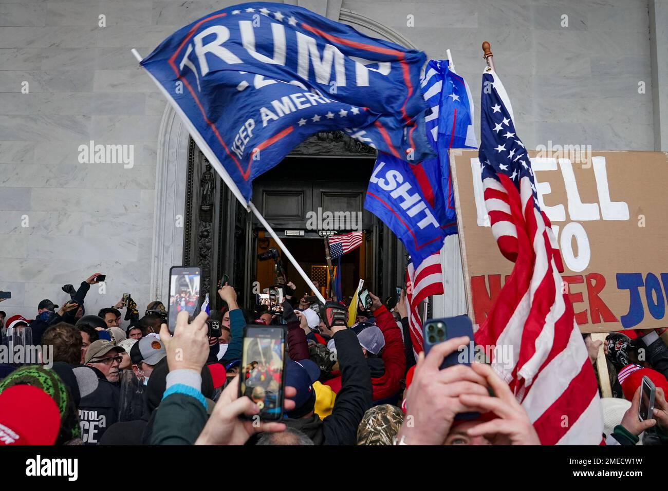 FILE - In this Jan. 6, 2021, file photo rioters break into the Capitol ...