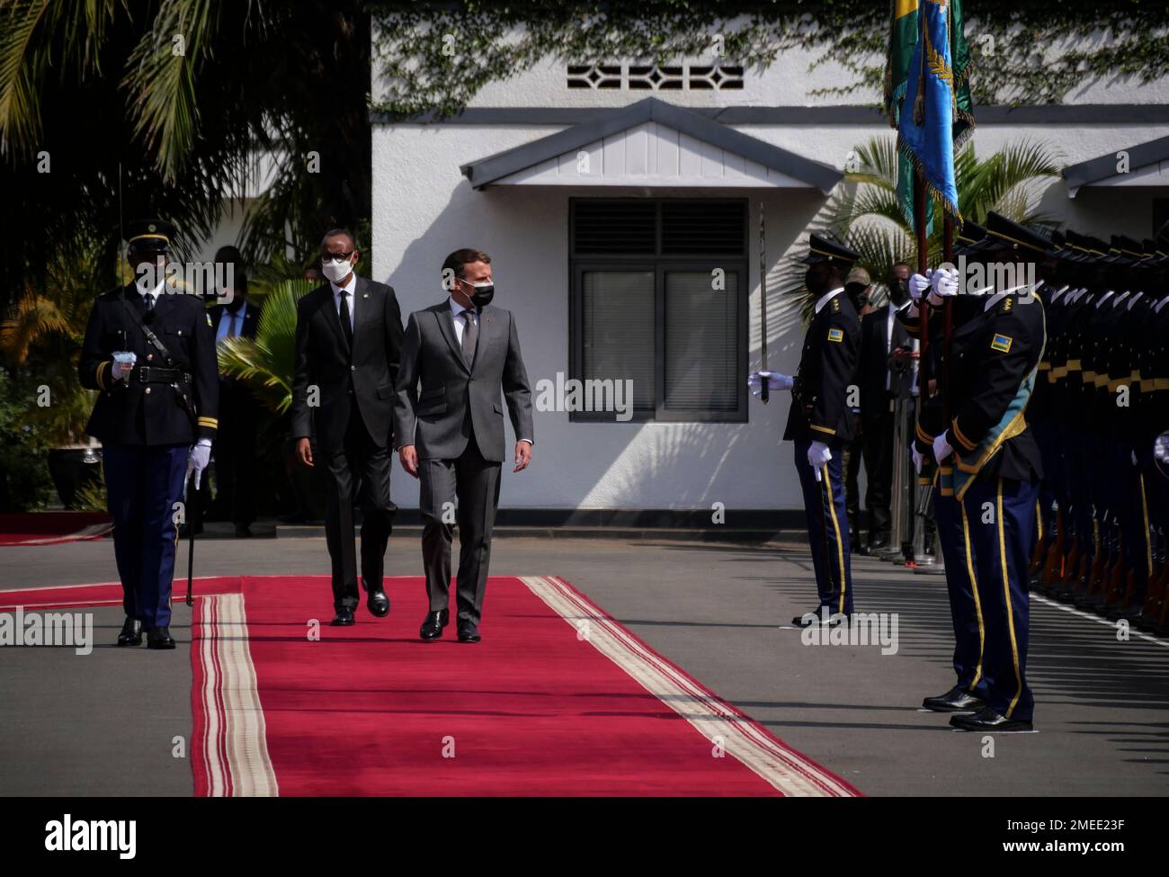 France's President Emmanuel Macron, center, inspects the guard of honor ...