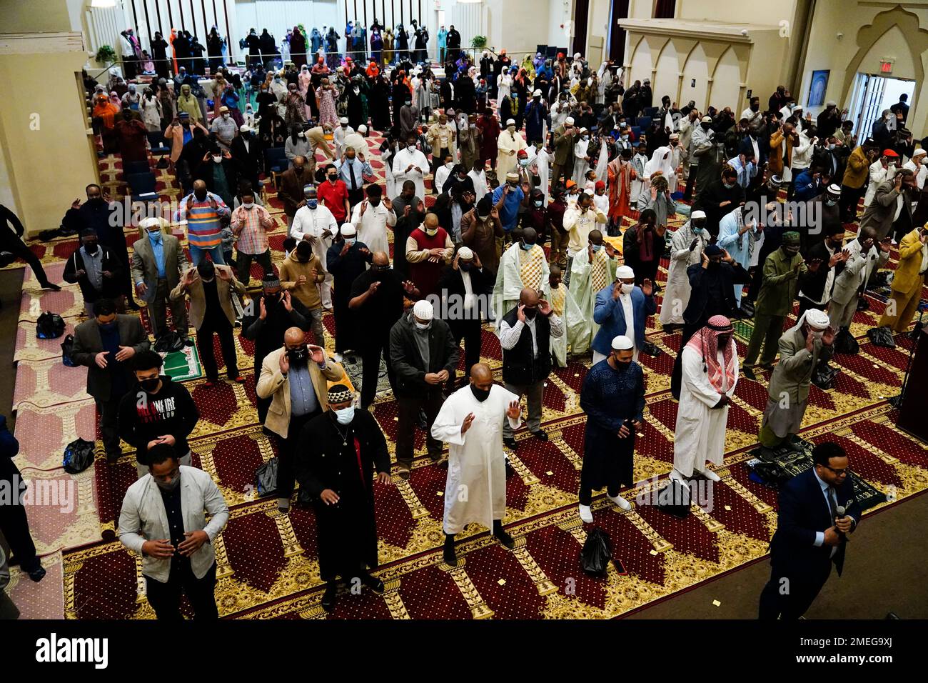 Worshippers perform an Eid al-Fitr prayer at the Masjidullah Mosque in ...