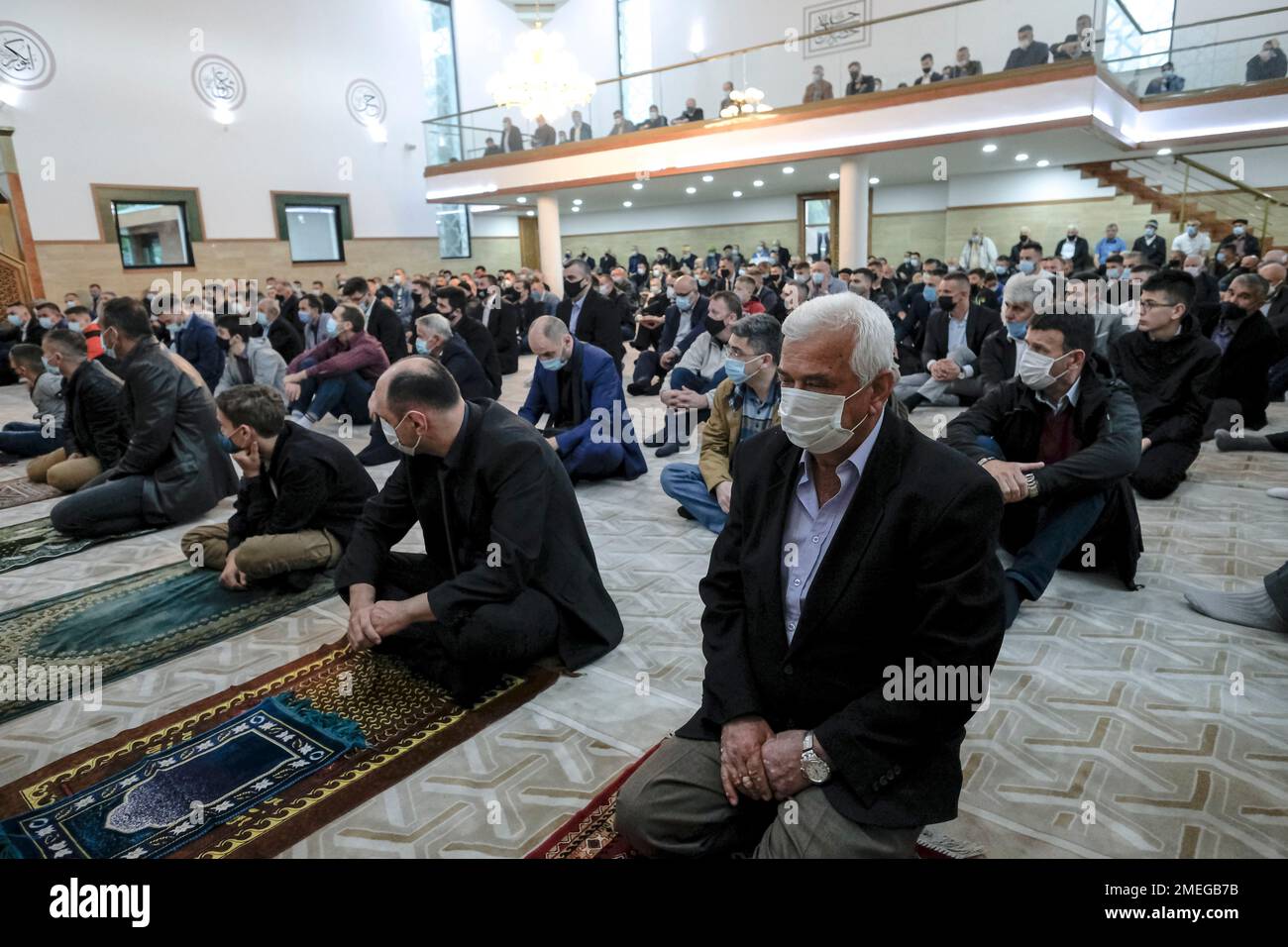 Bosnian Muslims, wearing face masks to protect themselves from the ...