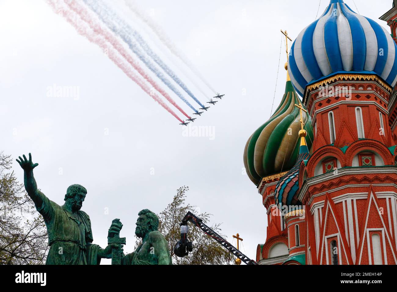 Russian warplanes fly over Red Square leaving trails of smoke in ...