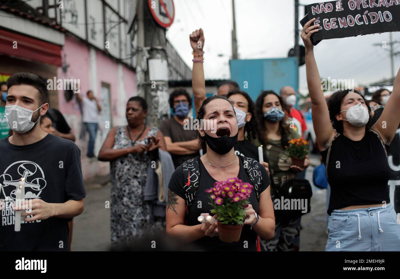 Activists and relatives of victims shout slogans against police and ...