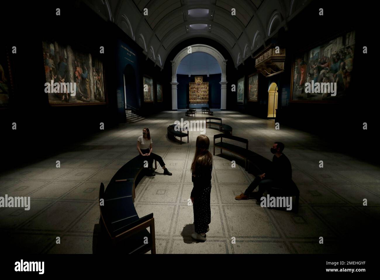 Staff members pose for photographs by the Raphael Cartoons, which began ...