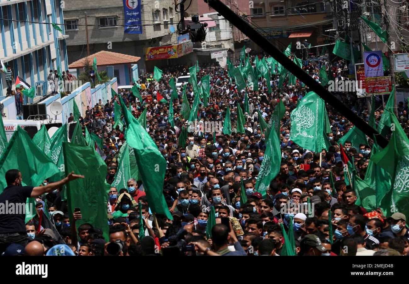 Hamas supporters wave green Islamic flags during a rally in solidarity ...