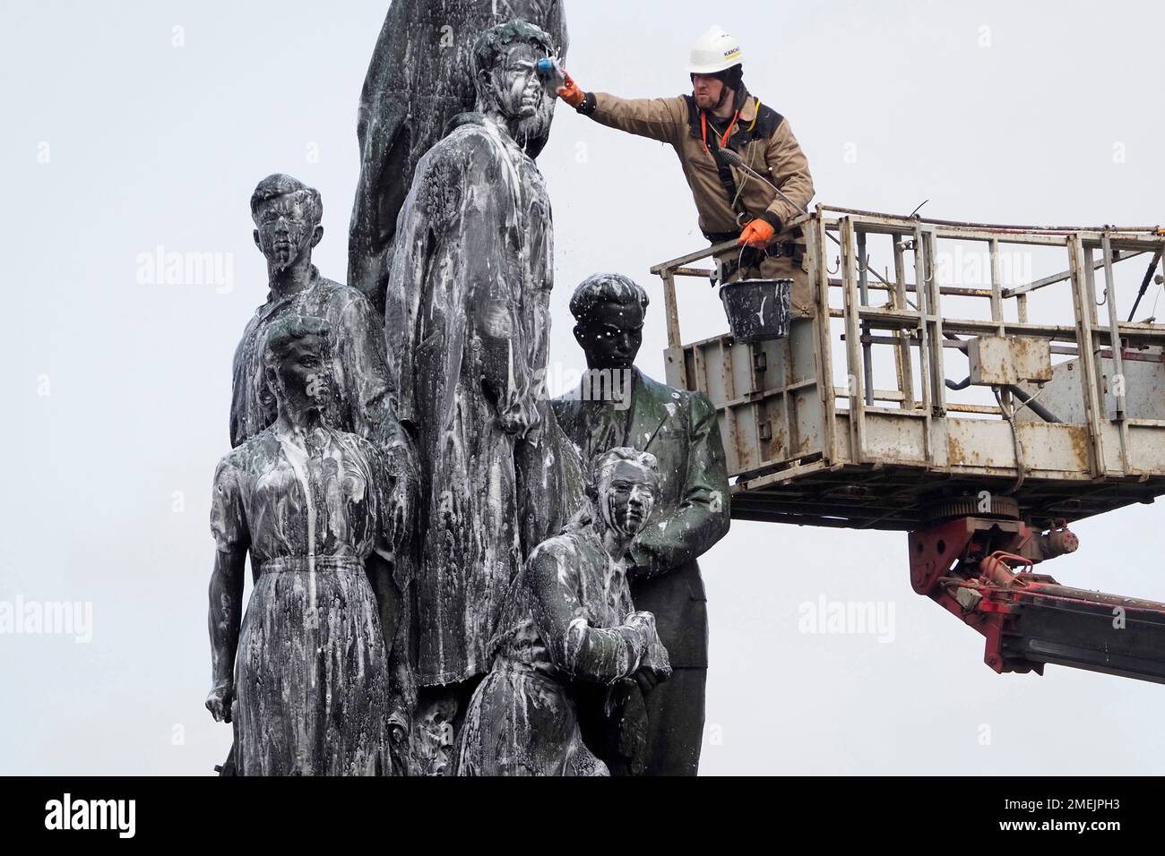 A worker washes a monument for heroes of the town of Krasnodon who died ...