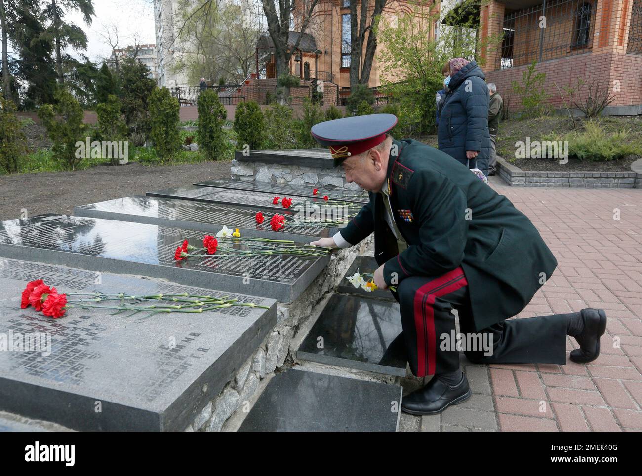 A Ukrainian army general lays flowers to the Chernobyl victims monument ...