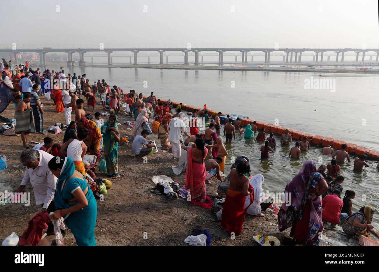 Hindu devotees perform morning rituals at Sangam, the confluence of the ...