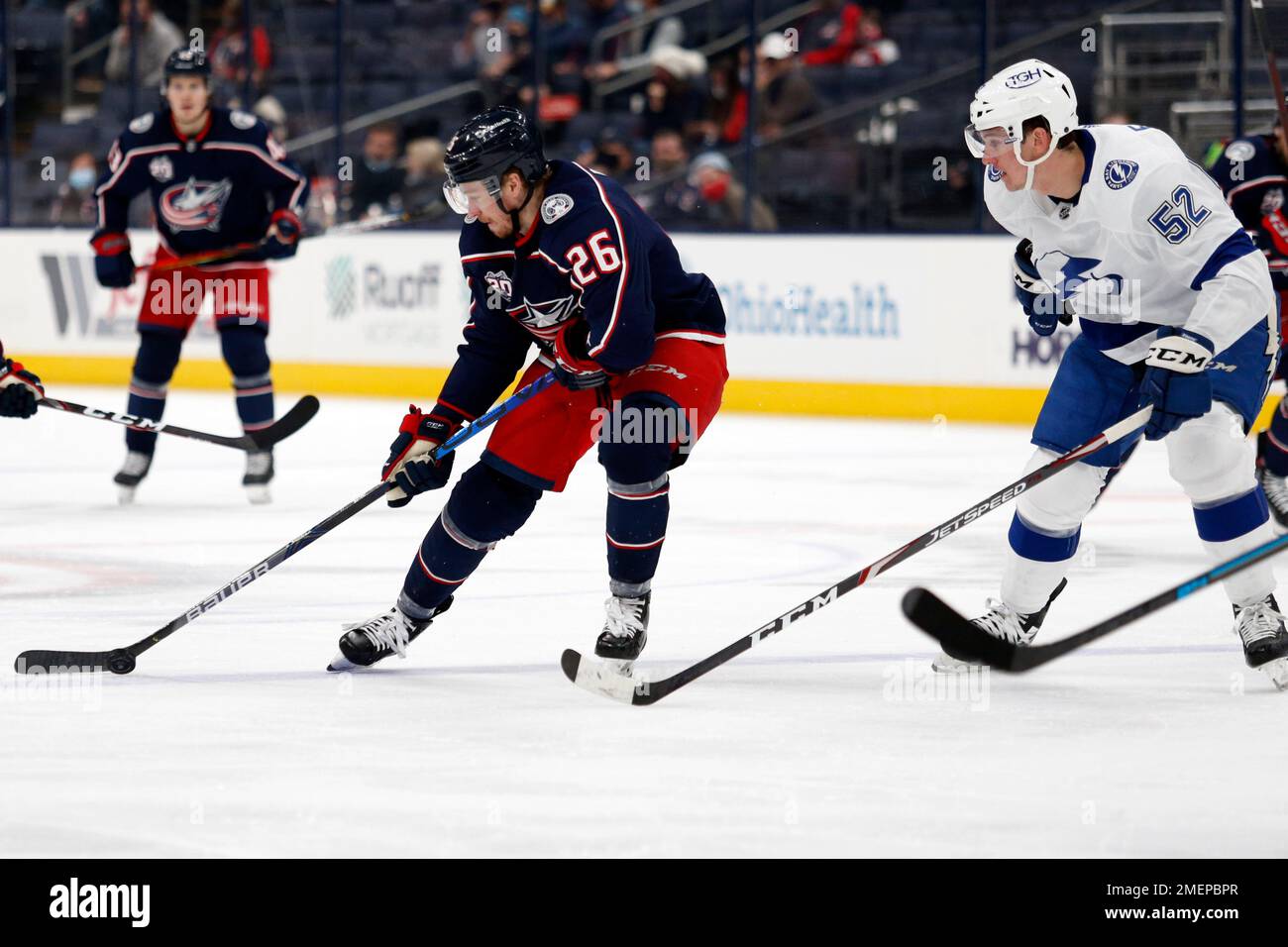 Columbus Blue Jackets forward Zac Dalpe, left, controls the puck in ...