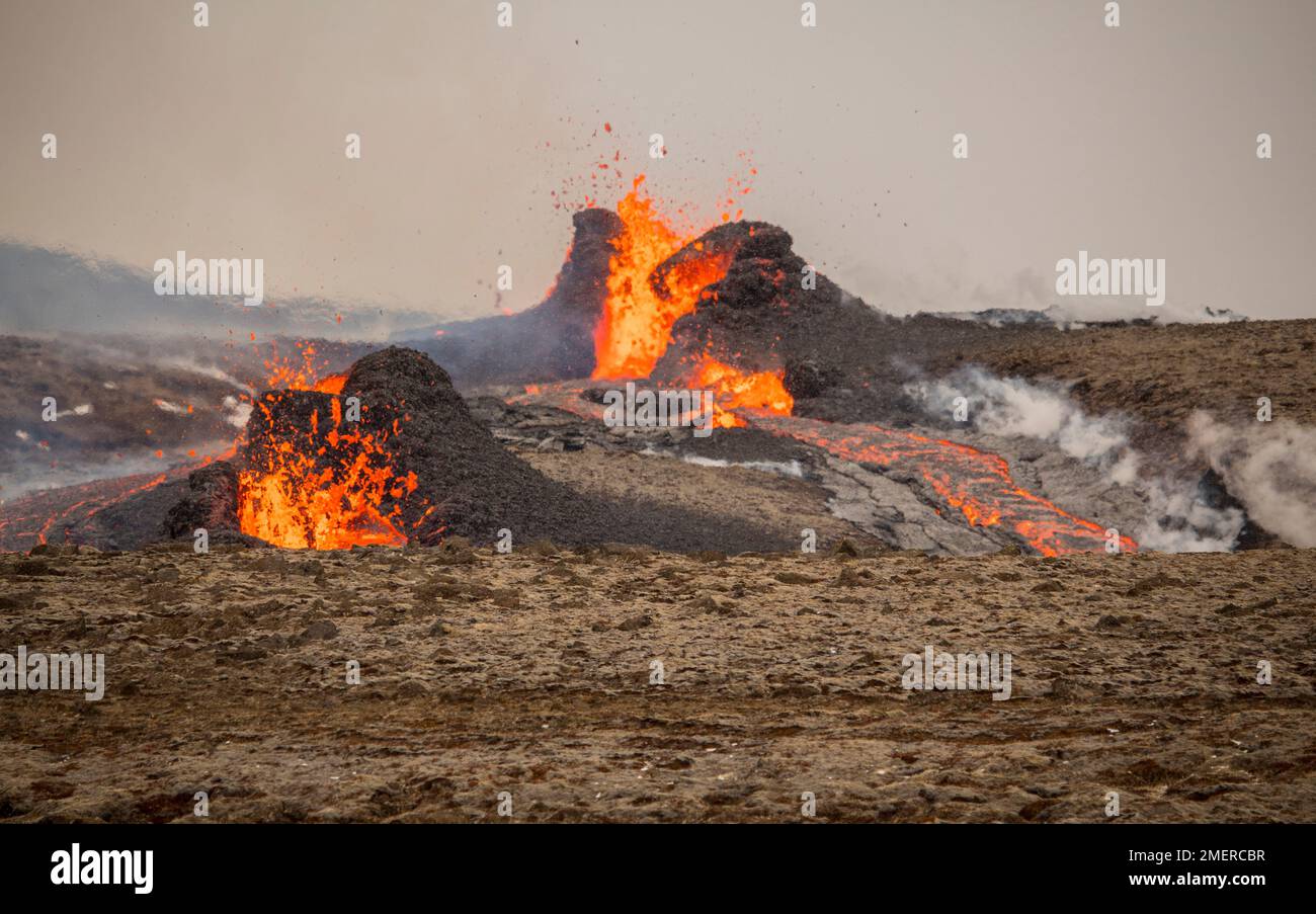 Steam and lava spurt from a new fissure on a volcano on the Reykjanes ...