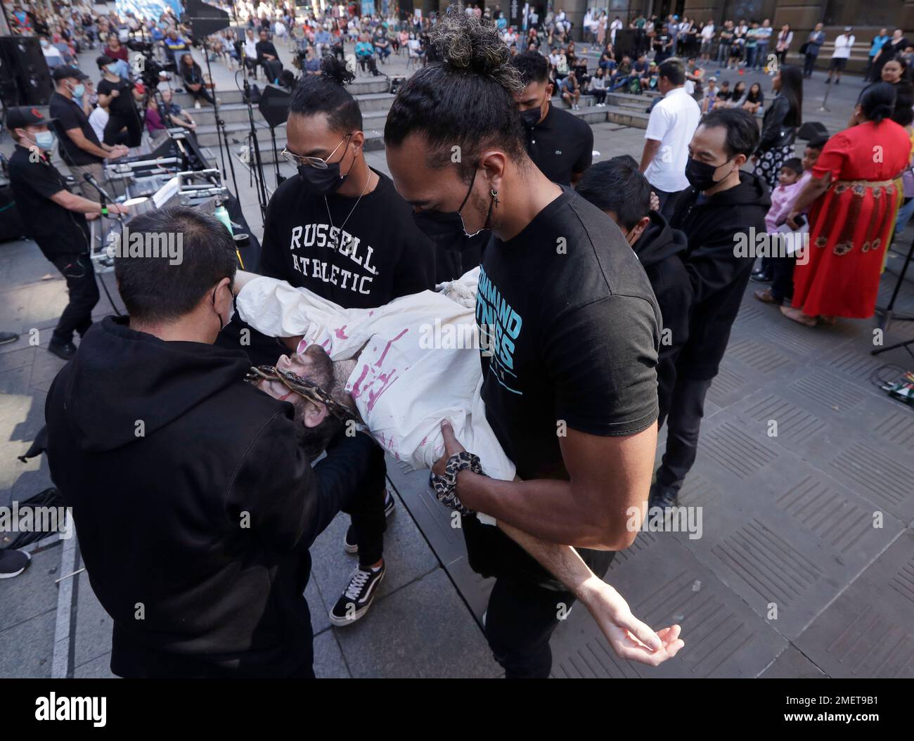 Actor Timothy Watkins is carried by men dressed in black to represent ...