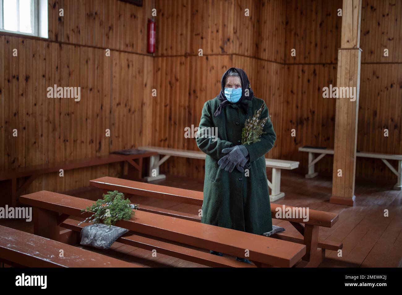A worshipper wearing a face mask to prevent the spread of the ...