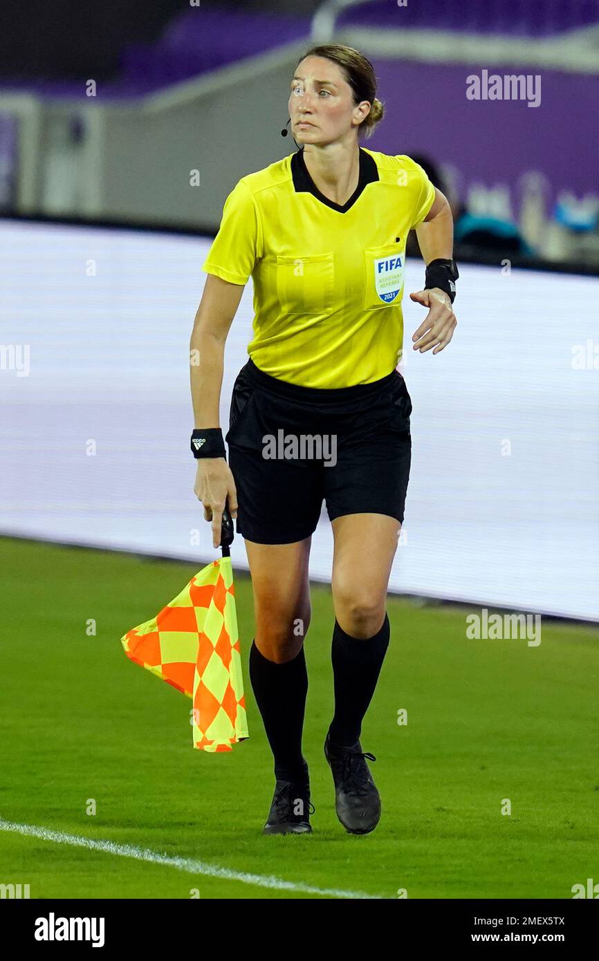 Assistant referee Kathryn Nesbitt runs the sideline as she watches play ...
