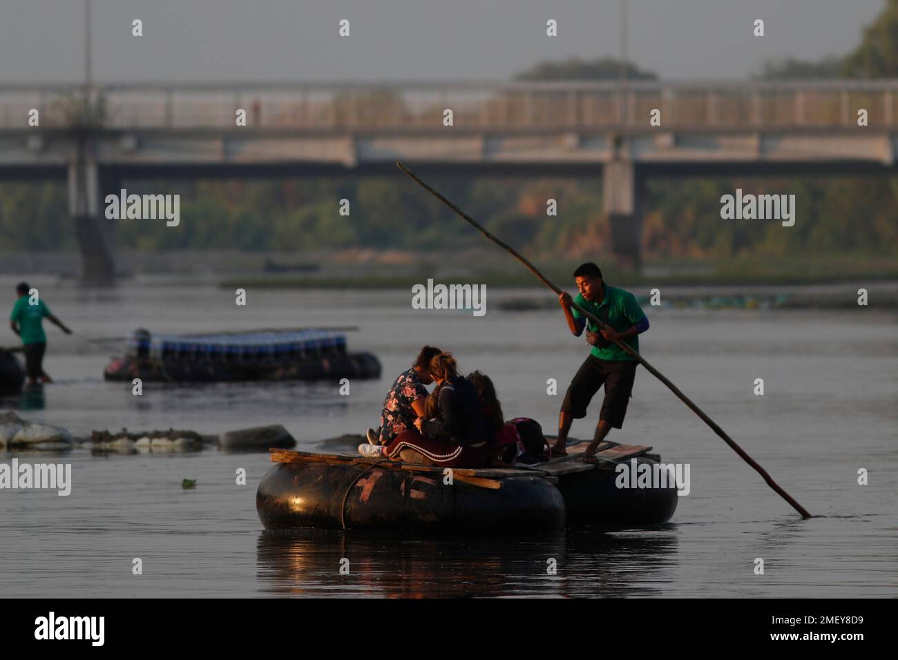 Guatemalan travelers cross the Suchiate River, border between Guatemala ...