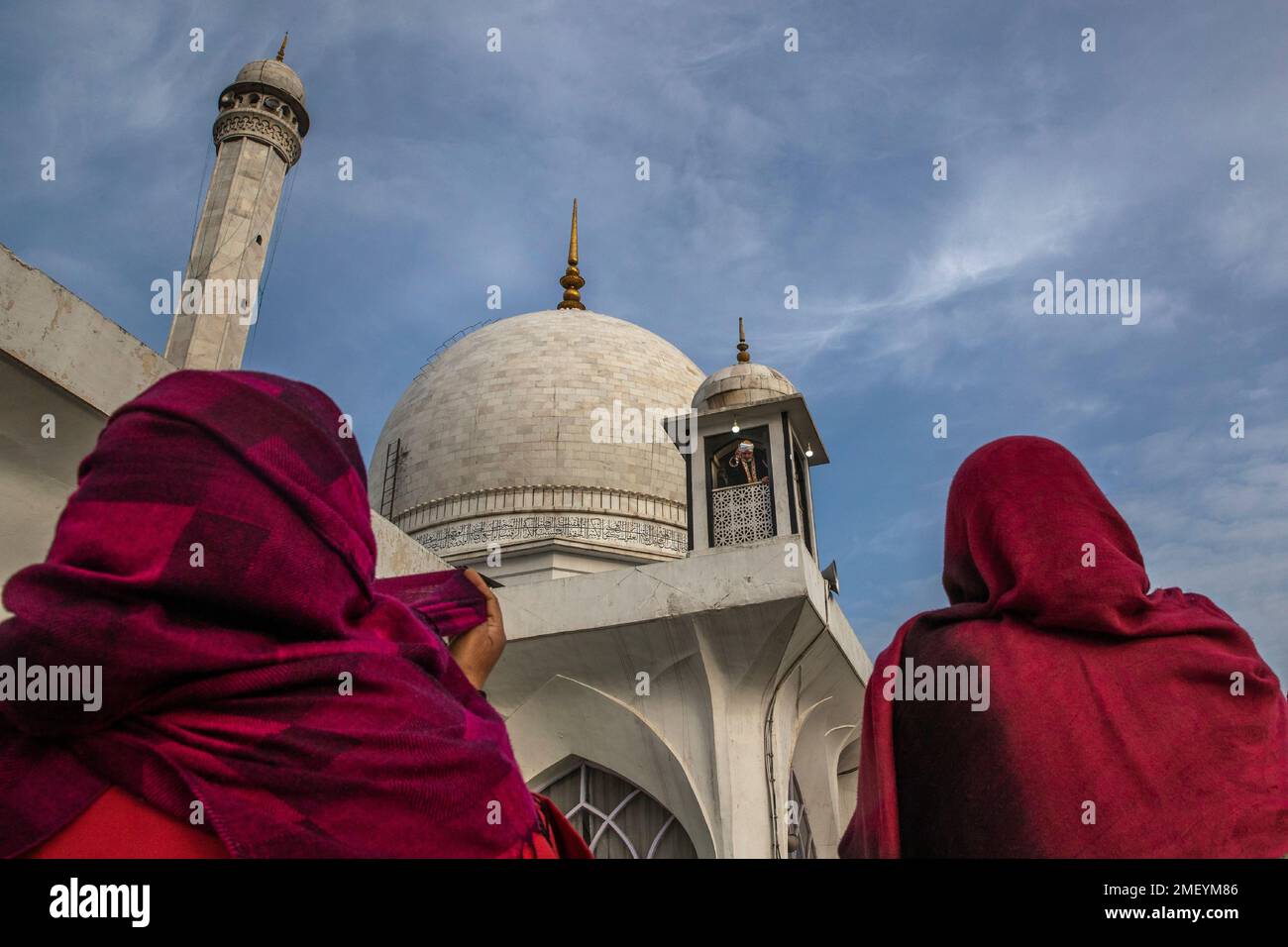 Kashmiri Muslim devotees pray as the head priest displays a relic ...