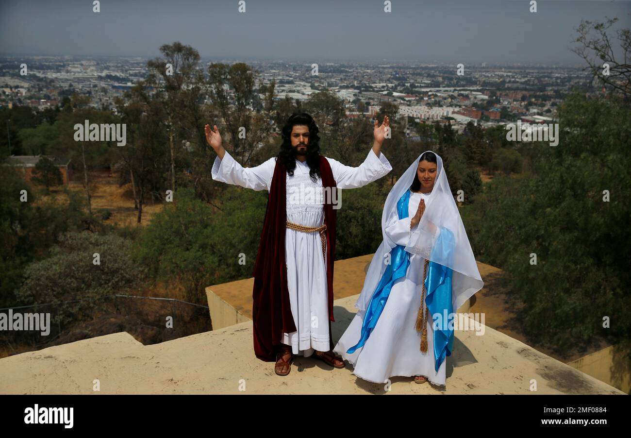 Playing the role of Jesus Christ, Brando Neri Luna, left, and Erika ...